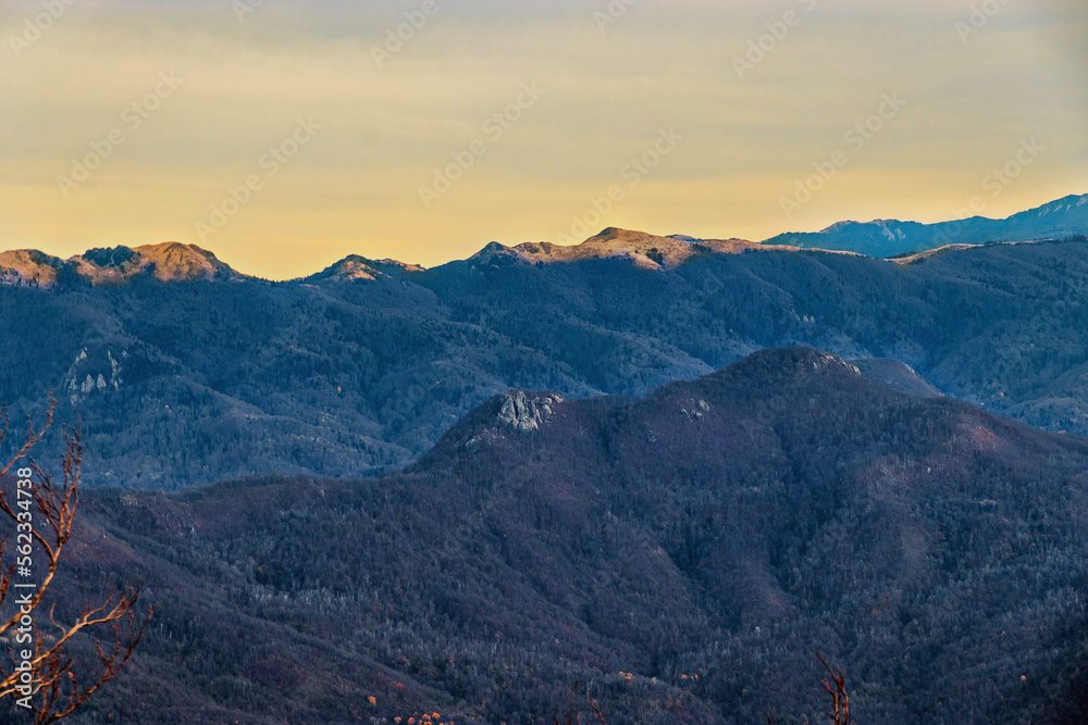 Stunning view of the ridge of mountain peaks from a height. View from a ...