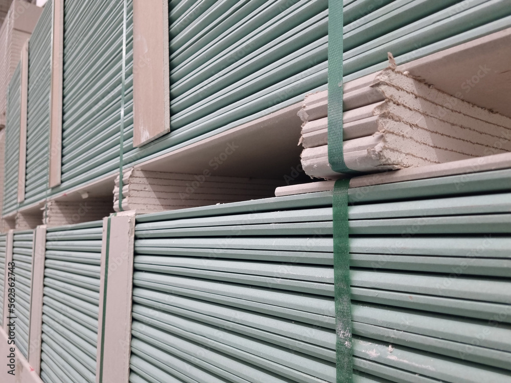 water resistant plasterboard sheets stacked in a hardware store. dry ...