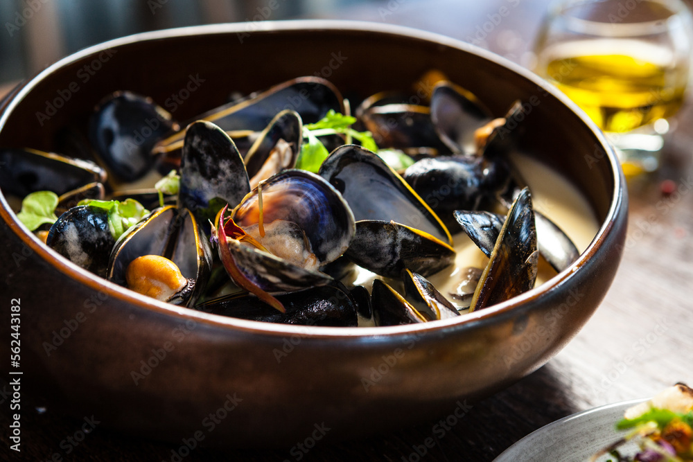 Blue mussels in cream wine sauce. Delicious healthy Italian traditional ...