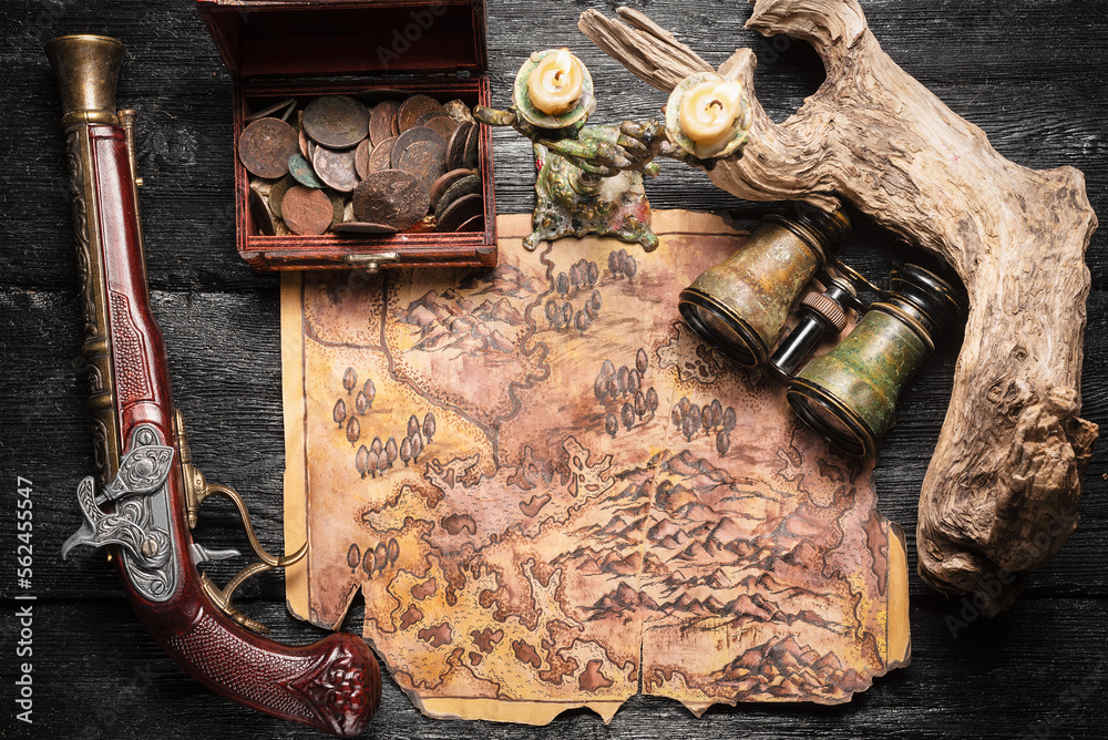 Ancient pirate treasure map, chest with ancient coins and musket gun on ...