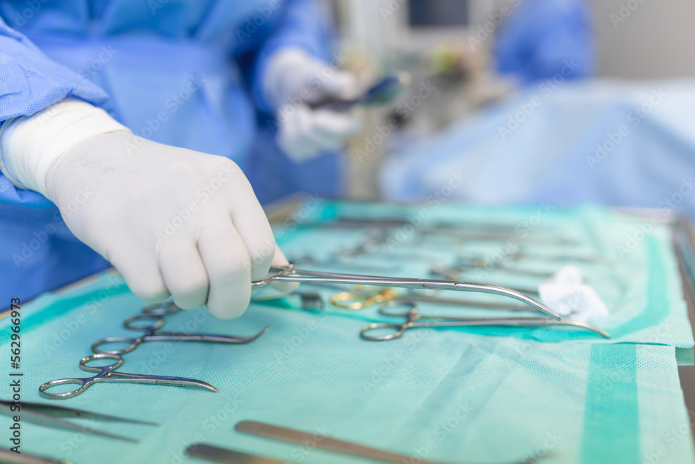 Operating Room of Surgical Table with Instruments, Assistant Picks up ...