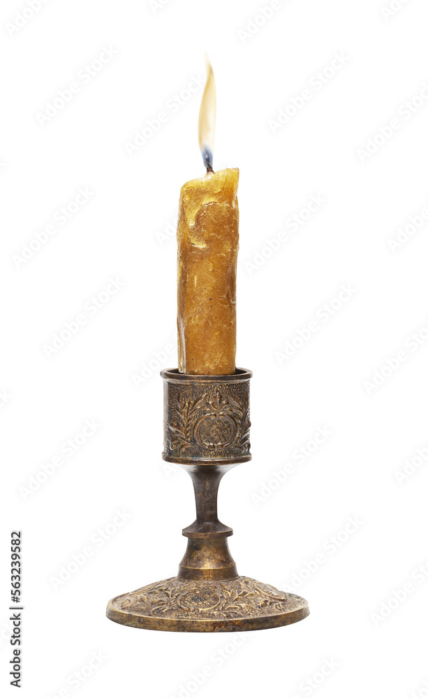 Burning old candle vintage bronze candlestick isolated on a transparent ...
