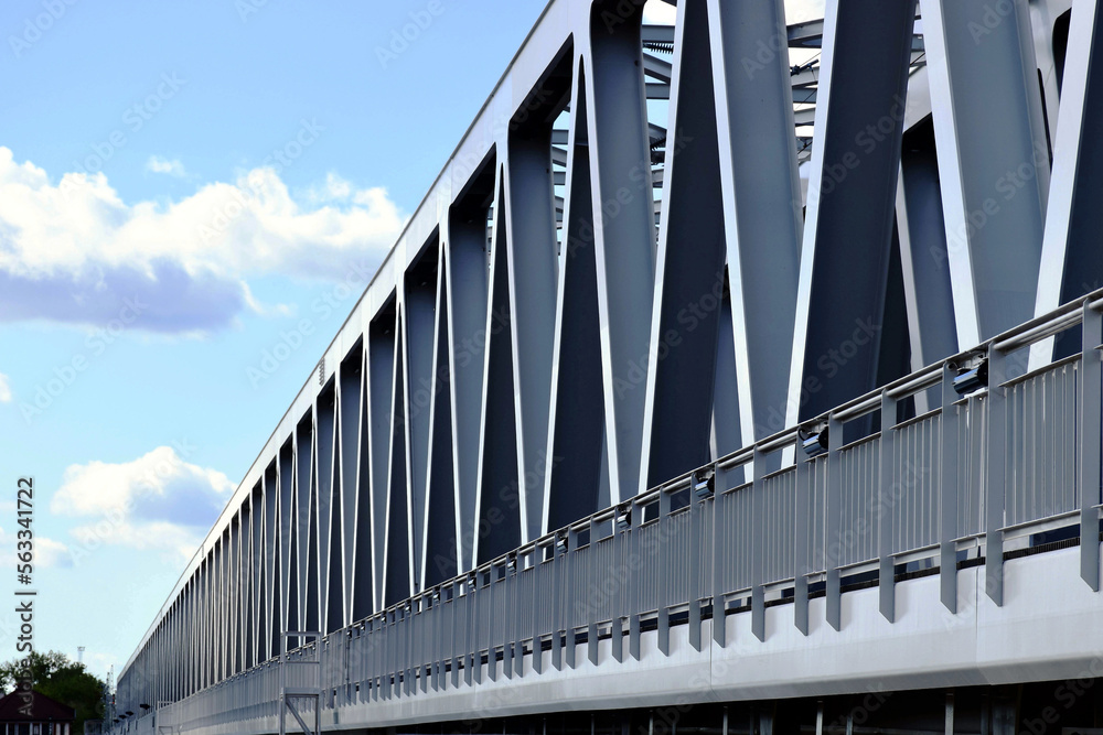 steel railway bridge girder closeup in perspective view. blue sky with ...