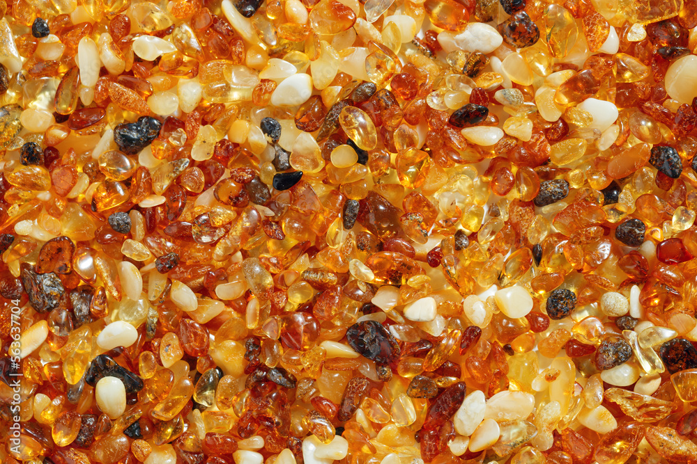 Natural gemstone amber texture background, small stones yellow orange ...