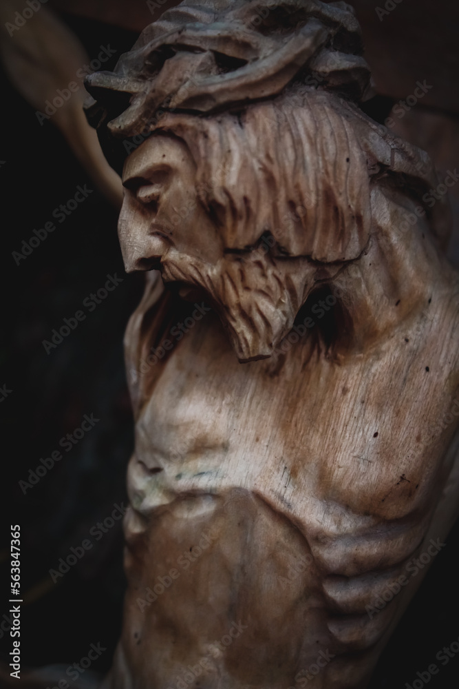 Jesus Christ crucified (close up an ancient wooden sculpture) (details) Vertical image Stock ...