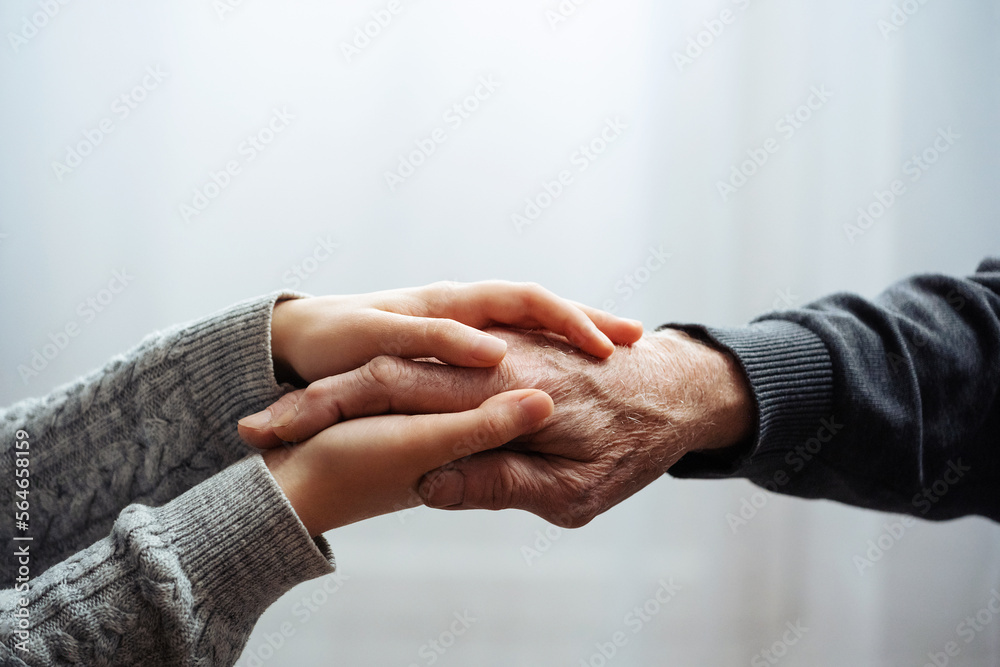 Old And Young Hands Holding