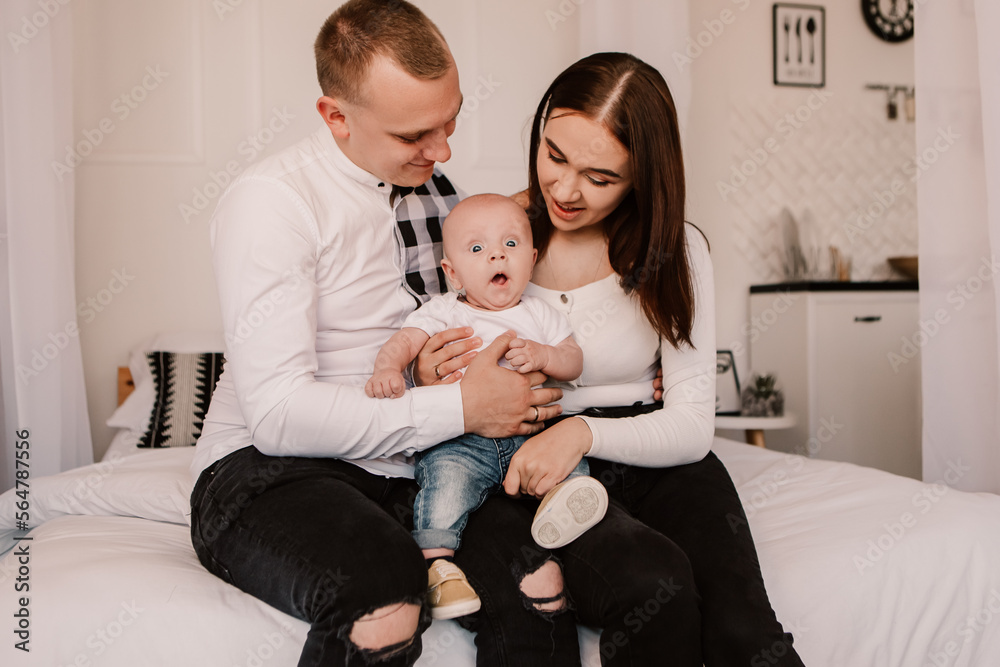 Little boy pop-eyed surprised cute child baby playing with parents ...