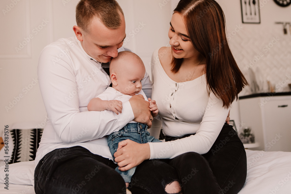 Little boy pop-eyed surprised cute child baby looking at mother breast ...