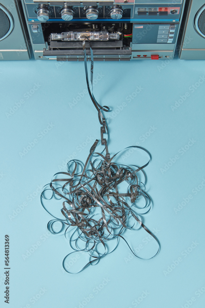 Tangled cassette tape from music stereo system. Stock Photo | Adobe Stock