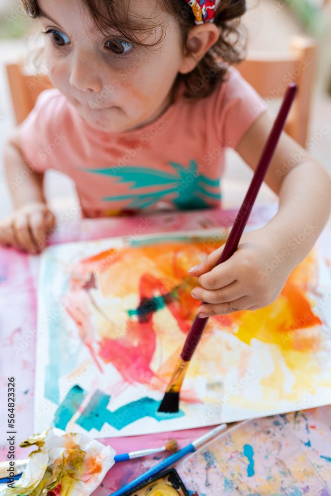 Little Girl having fun painting and drawing Stock Photo | Adobe Stock
