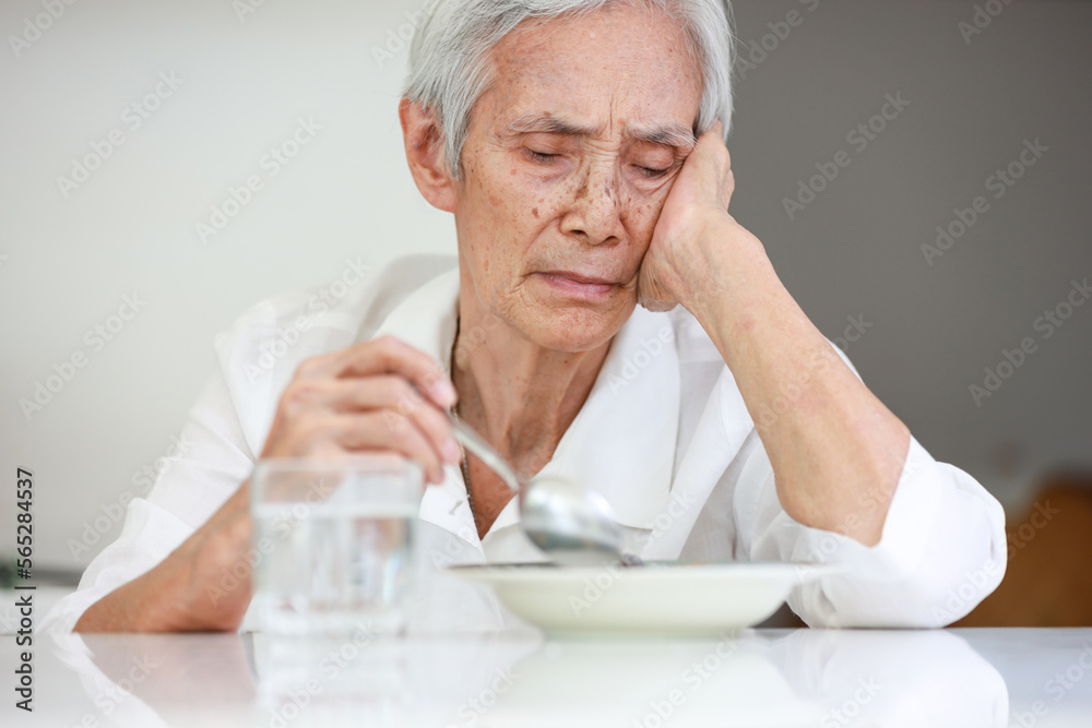 Photo Stock Sick asian senior woman suffering from anorexia,bored with ...
