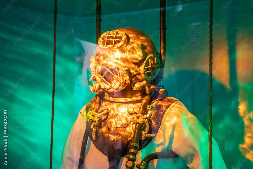 Inside Of The Uss Alabama Battleship With Glass Case Filled With A Underwater Diving Suit And A