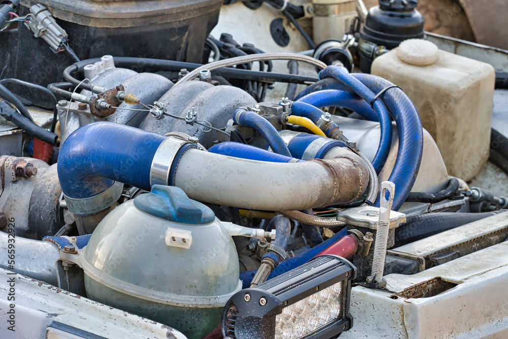 Tuned SUV engine. Silicone pipes of intake system are blue. Stock Photo ...