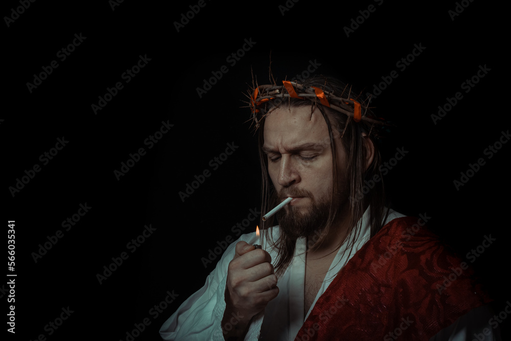 Jesus Christ smokes a cigarette wearing a crown of thorns and white ...