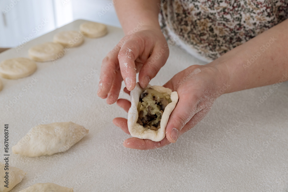 Yeast dough using to make buns with potatoes, on white countertop, at ...