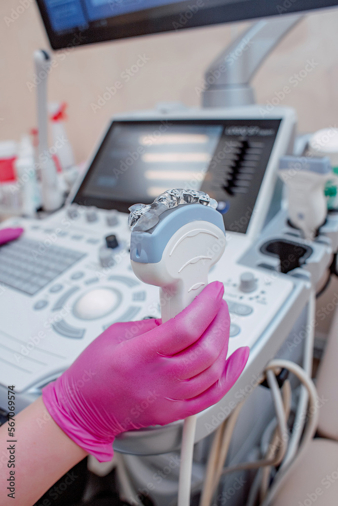 Foto de Stock Probe for ultrasound diagnostics close-up. The doctor ...