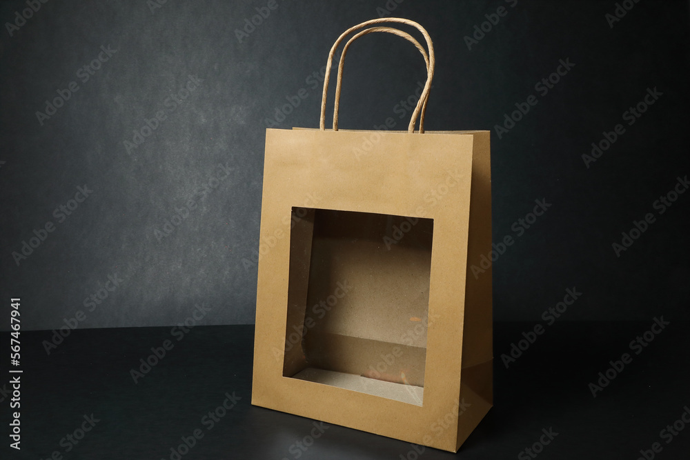 Beautiful packaging for gifts on a black background. Paper bags, boxes ...