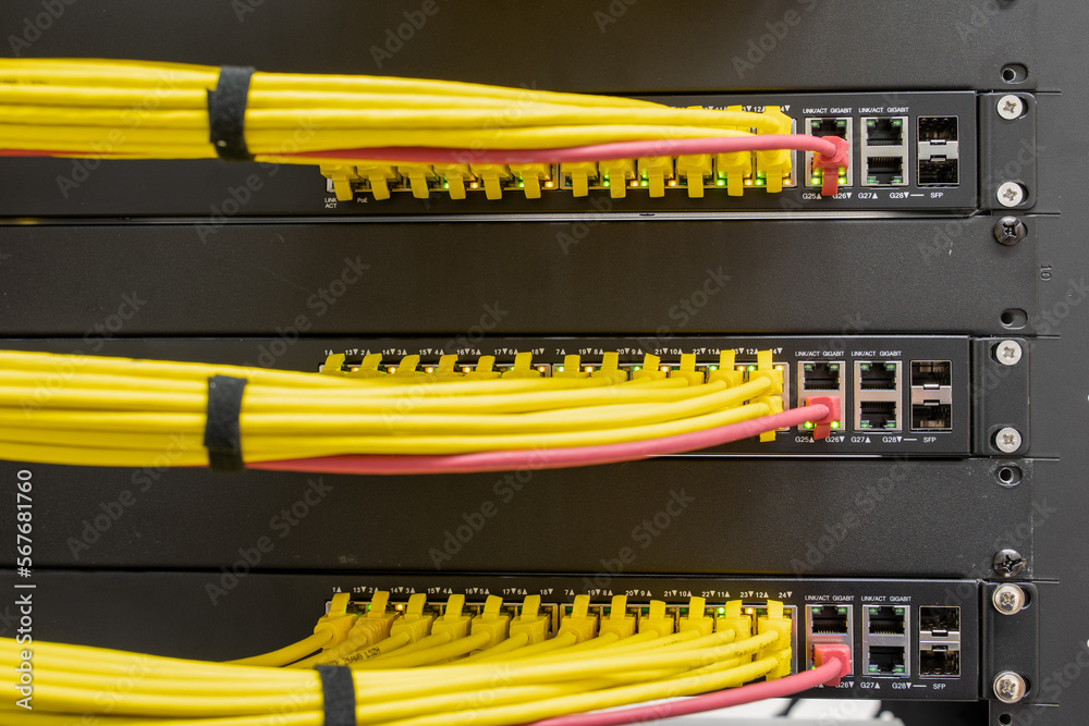 Foto de Stock Selective focus on neat and tidy patched network cables ...