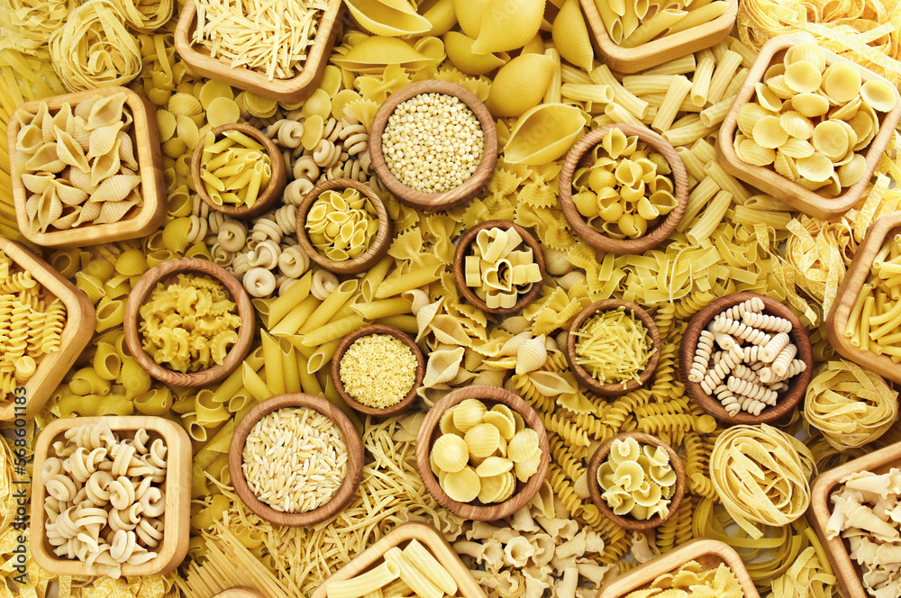 Mix of pasta shapes varieties: penne and fusilli, farfalle and macaroni ...