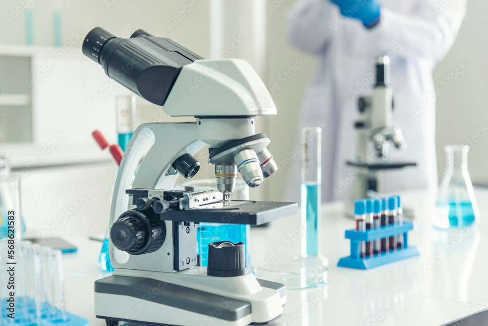 Science microscope equipment in biology chemical laboratory. Scientific ...