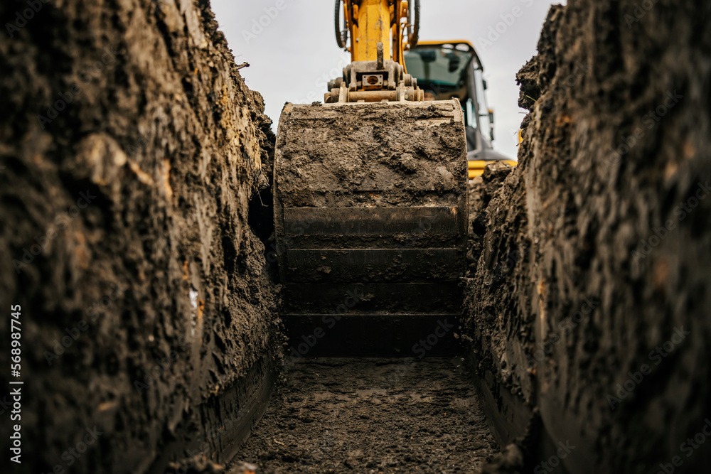 Foto de Stock Close up of a bulldozer digging foundation on ...