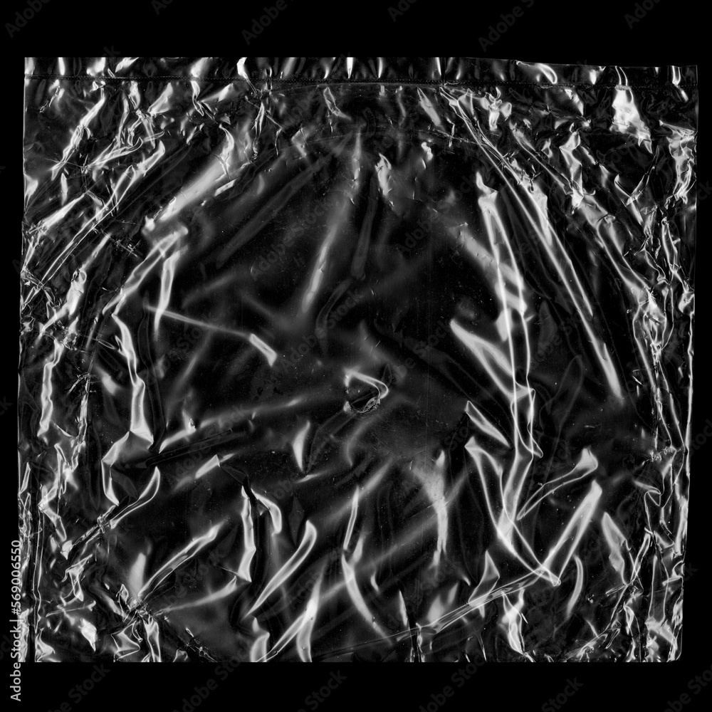Wrinkled plastic wrap texture on a black background wallpaper. Royalty ...