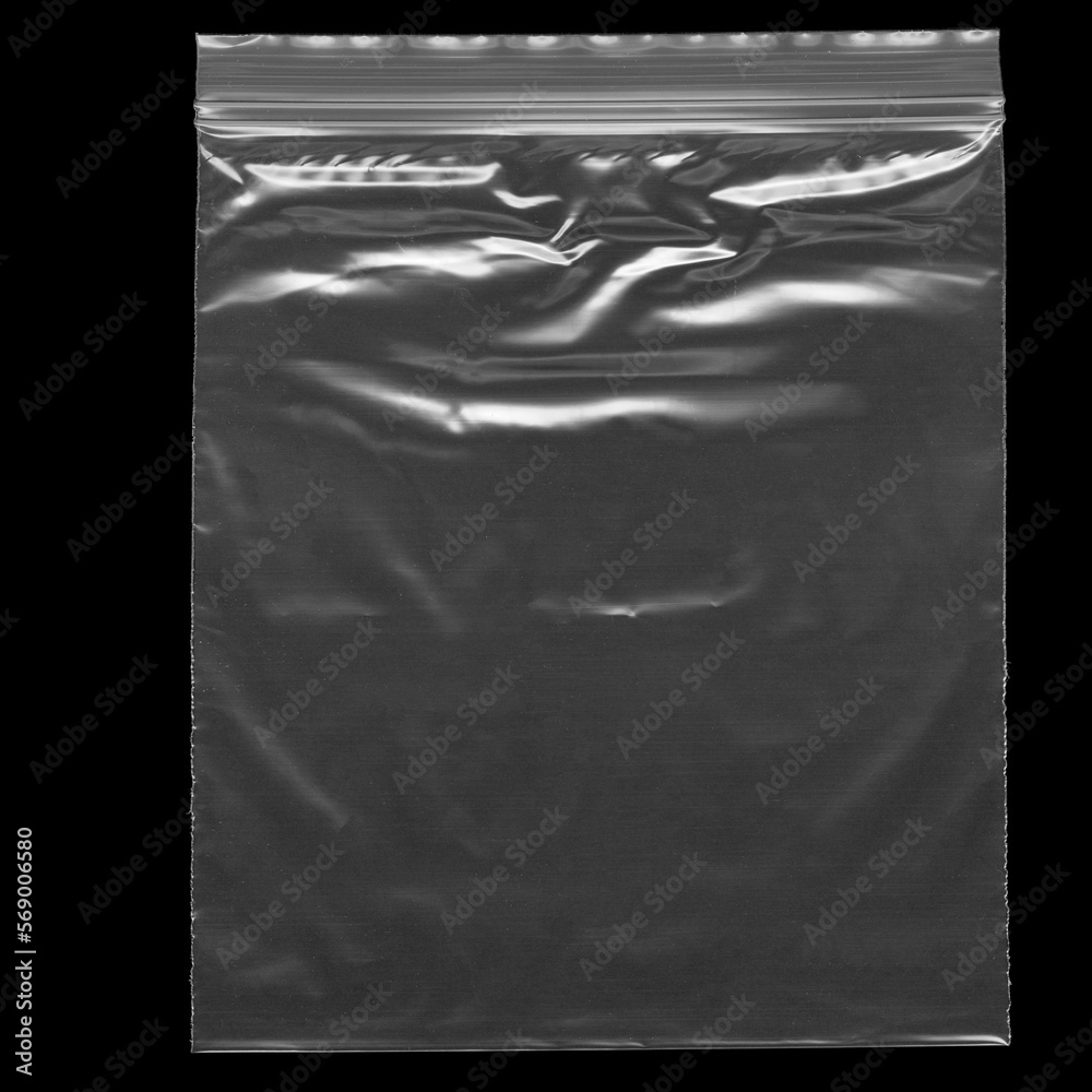 Wrinkled plastic wrap with zipper texture on a black background ...
