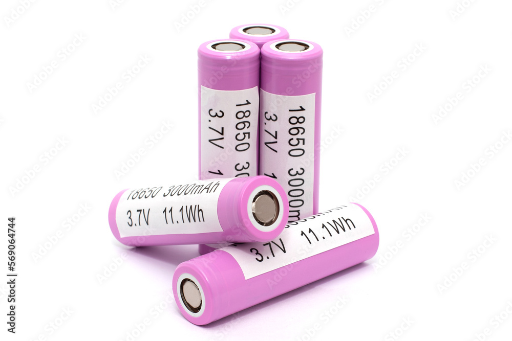Five pink lithium batteries isolated on a white background with an ...