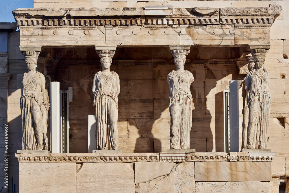 Caryatids, women figures statues at Erechtheion ancient Greek temple, on Acropolis hill ...
