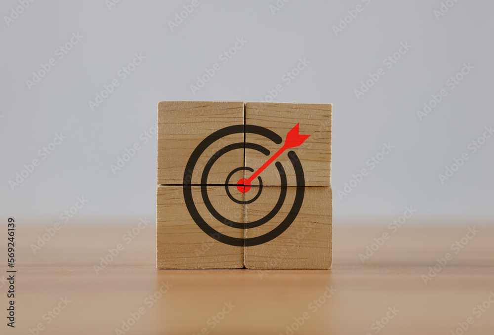Four wooden blocks stacked together with an arrow in the middle, goal ...
