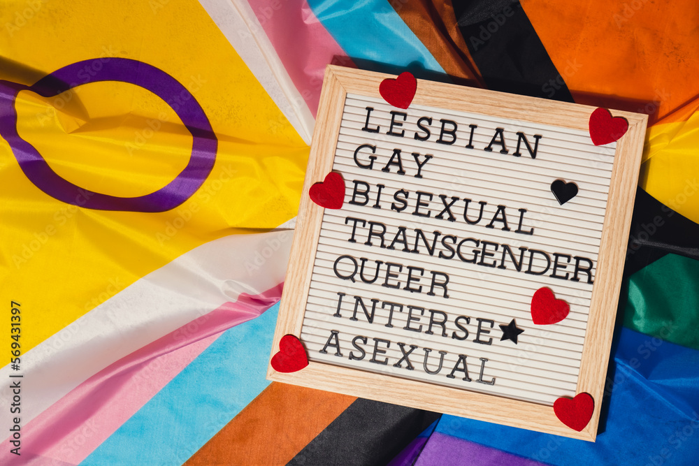 Foto de Stock LGBTQIA description frame on Rainbow LGBTQIA flag made ...