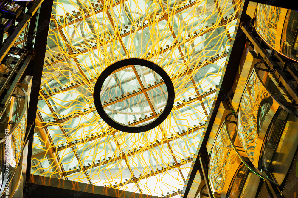 Glass roof atrium, construction and elevator shaft in modern building ...