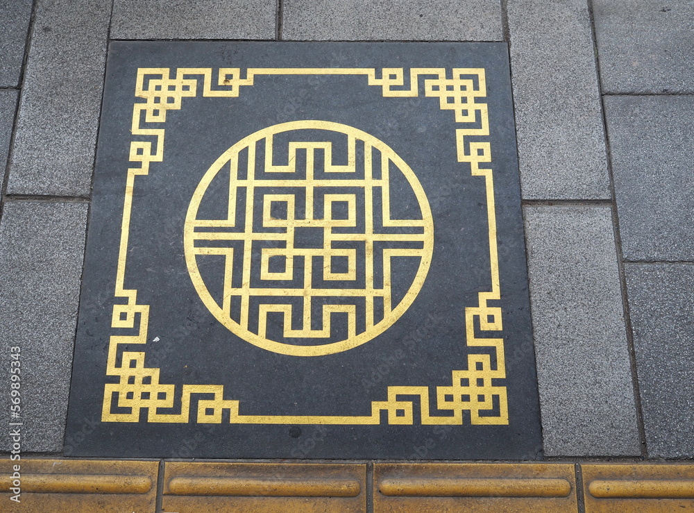 Corridor on Thalang Road with black tiles with beautiful golden Chinese ...