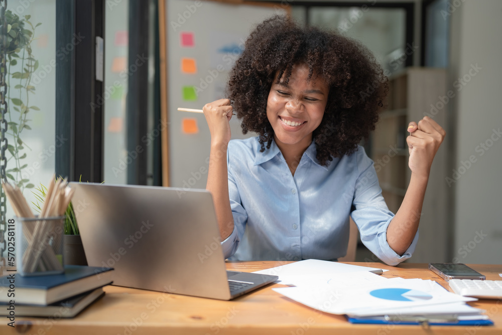 Excited happy African American woman feeling winner rejoicing online ...
