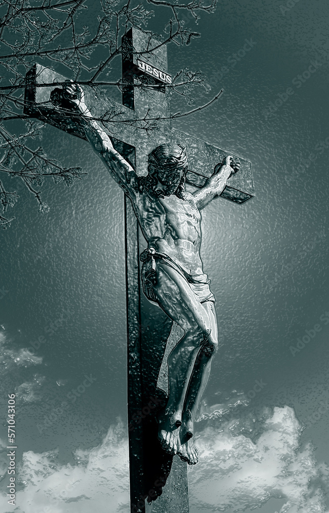 Crucified Jesus in Gods emerald light. Statue of Jesus Christ. A photo ...