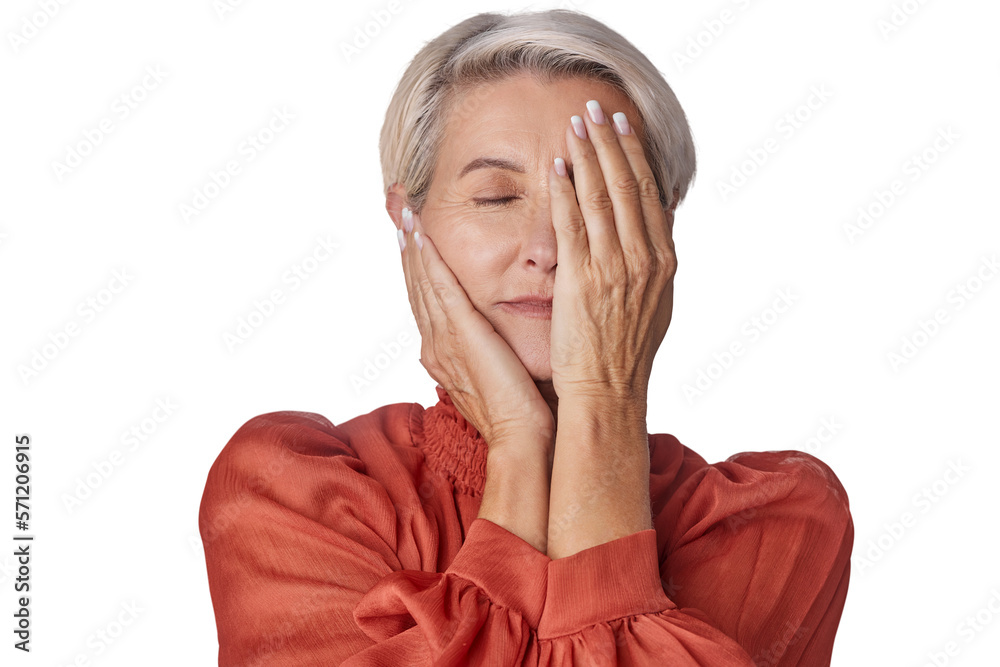 An adult senior woman touching her perfect skin. Beautiful mid 50s aged ...