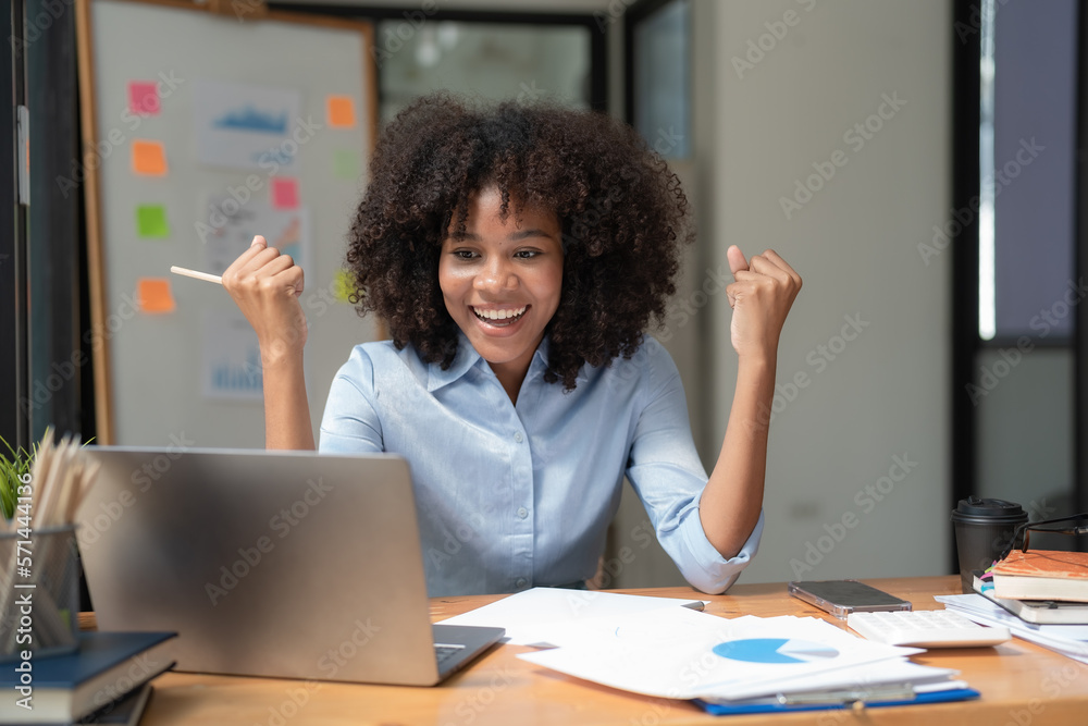 Excited happy African American woman feeling winner rejoicing online ...