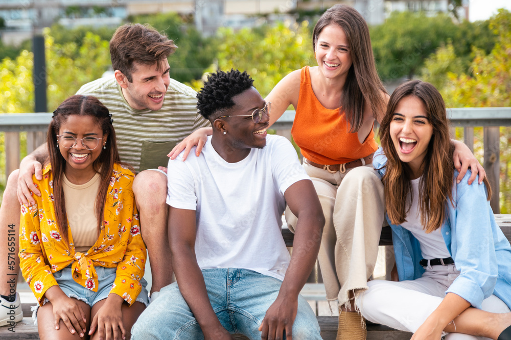 Group of five cheerful multiracial friends having fun outdoors - happy ...