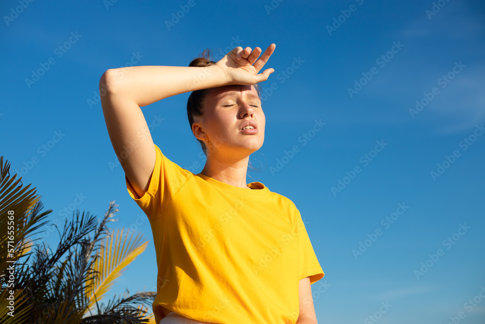 Girl is suffering from heat, woman with heatstroke. Having sunstroke at ...