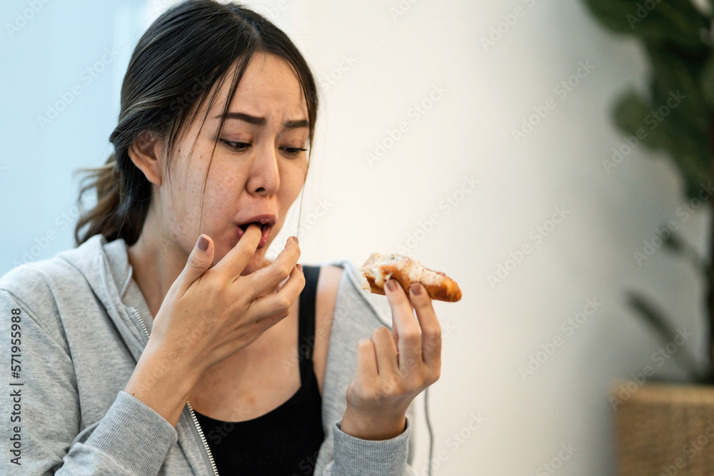 pretty woman enjoying unhealthy junk food. beautiful woman with no self ...