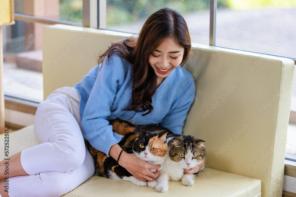 Millennial Asian Young Kindly Cheerful Female Owner Sitting On Cozy