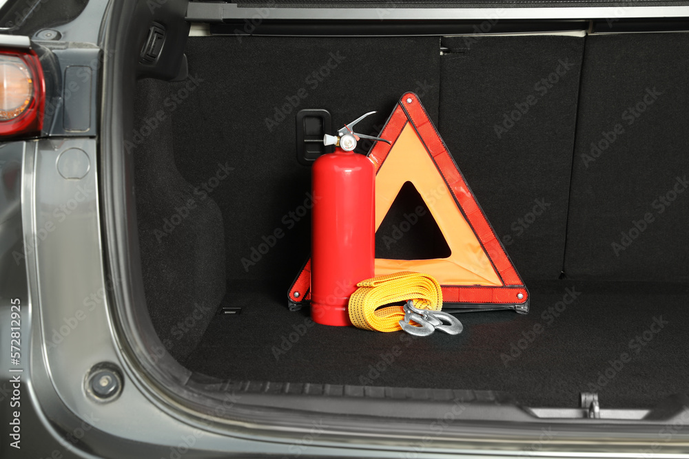 Red fire extinguisher, towing strap and foldable emergency warning ...