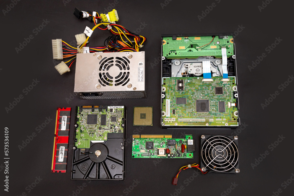 Disassembled computer parts recycled: hard disk drive (hdd), ram stick ...