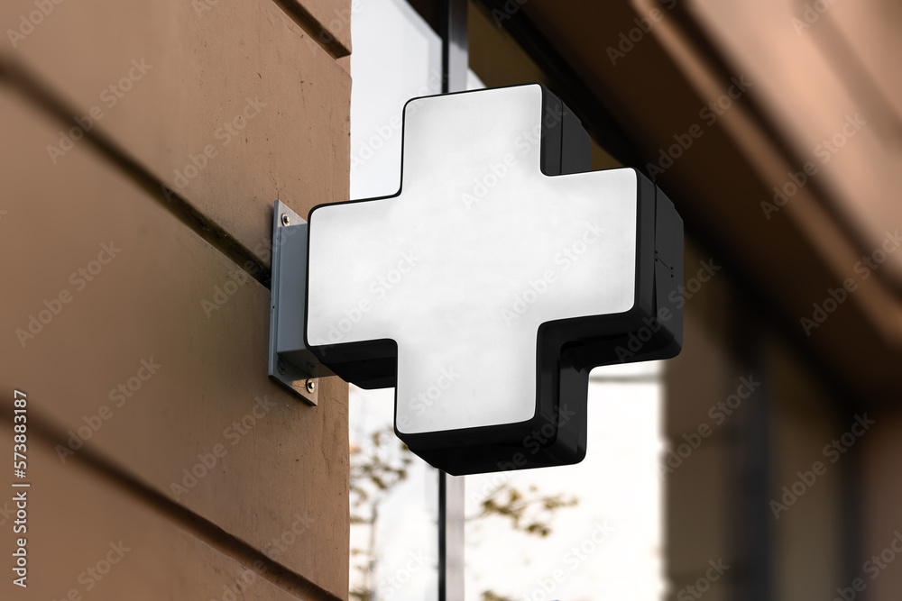 Blank pharmacy cross lightbox sign mockup in the urban environment ...