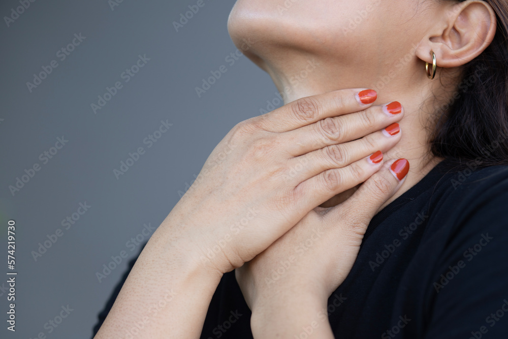 Beautiful young woman touching her sick neck with hands she has neck ...