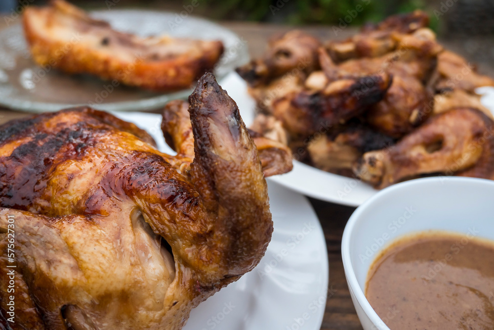 Plates of Lechon Manok or roasted chicken and Liempo or grilled pork ...