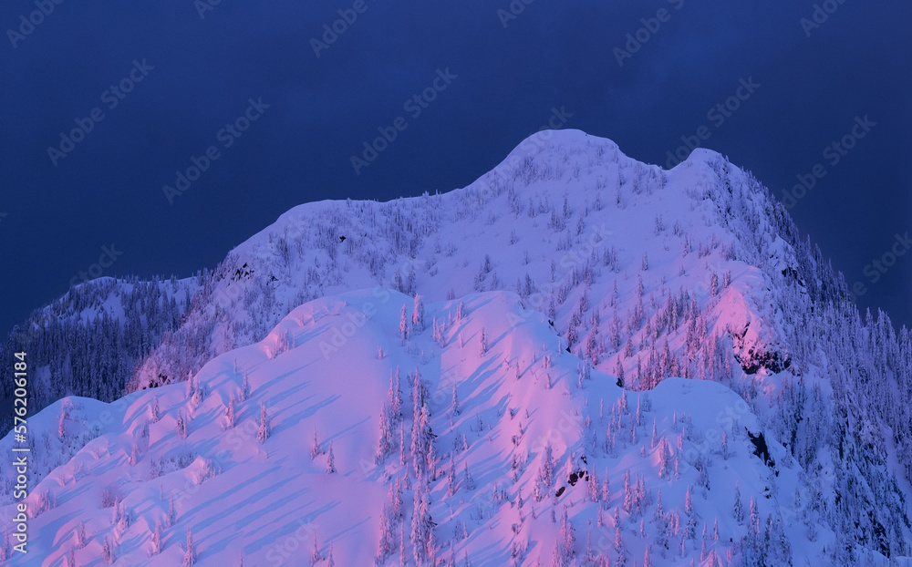 Pink snow covered mountains in sunset. Whistler Blackcomb ski resort ...