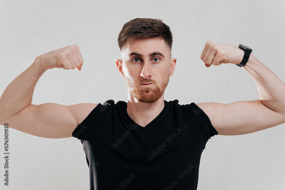 Portrait of strong bearded man demonstrating power in his hands ...