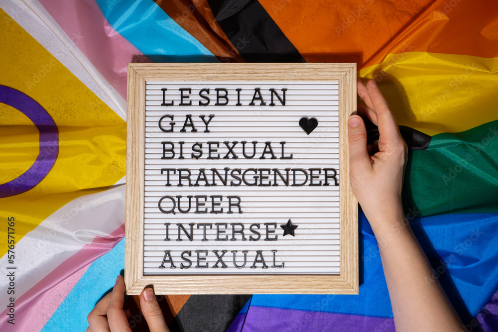 Stock-Foto „LGBTQIA description frame on Rainbow LGBTQIA flag made from ...