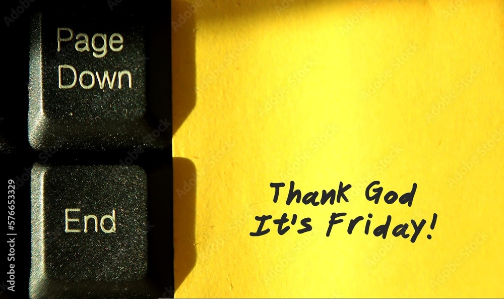 End letter on keyboard and yellow paper with text written THANK GOD ITS ...